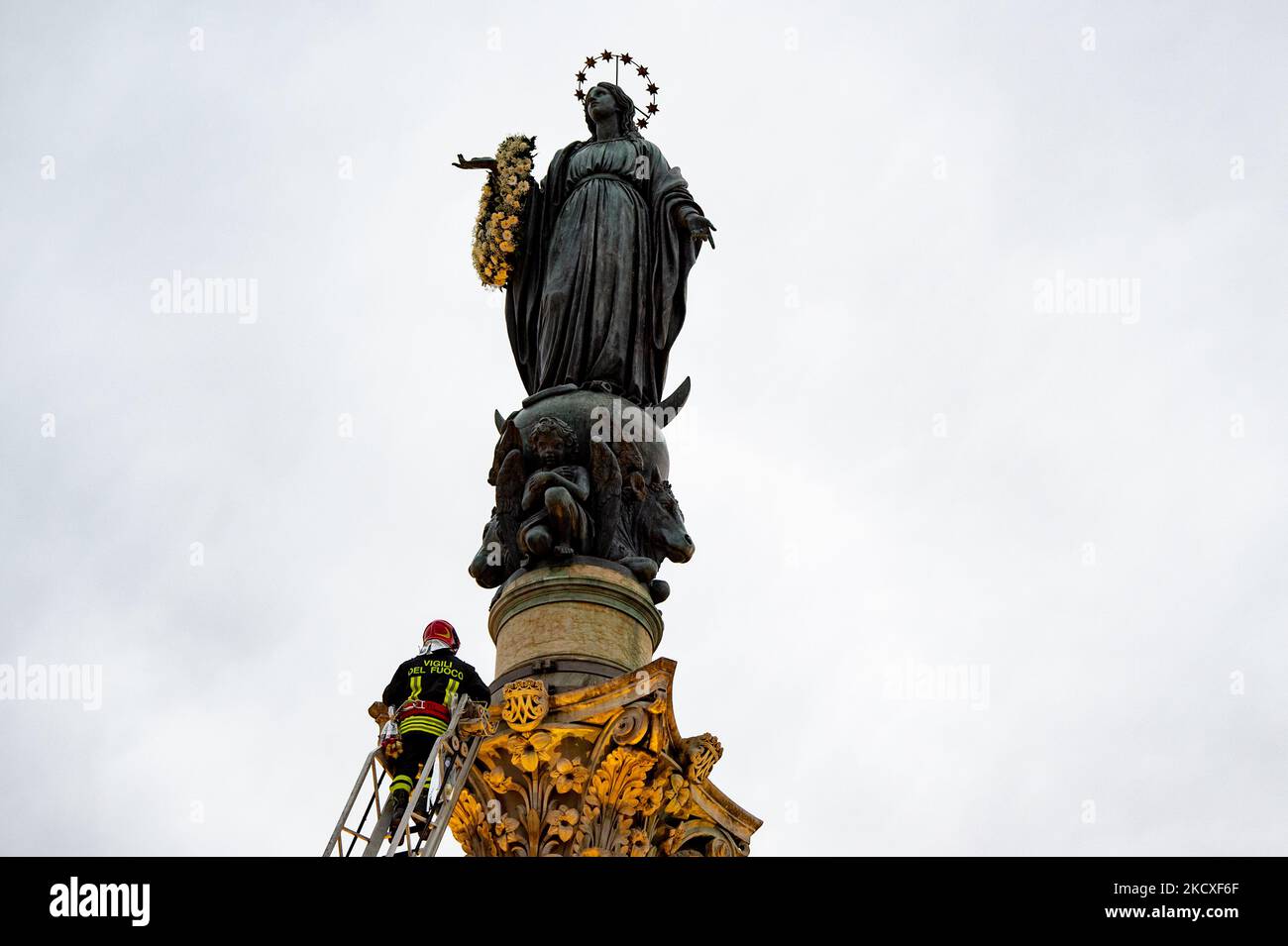 The Fire Brigade pays homage to the statue of the Madonna on the statue ...