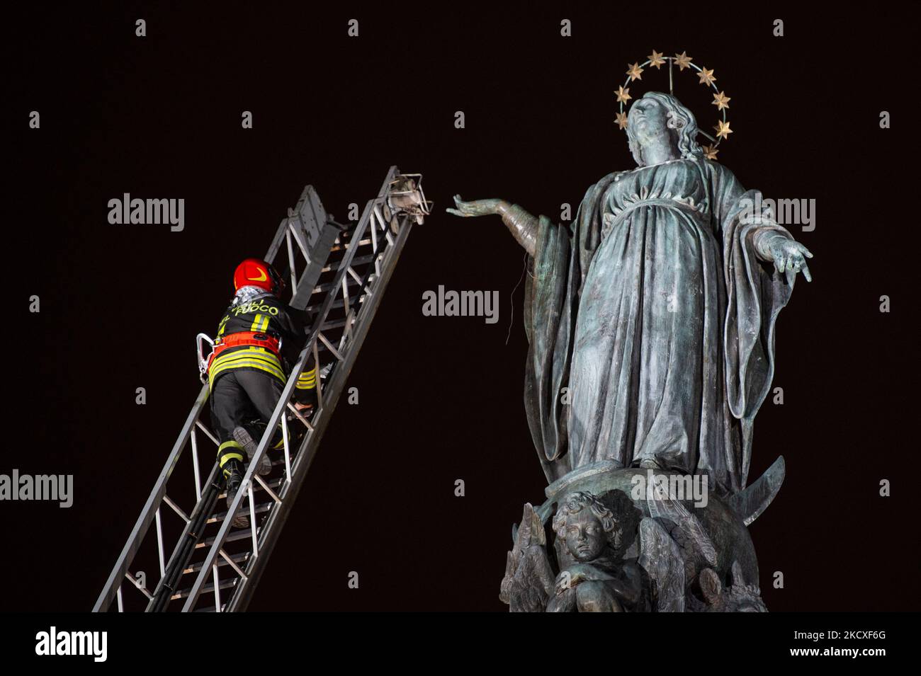 The Fire Brigade pays homage to the statue of the Madonna on the statue ...