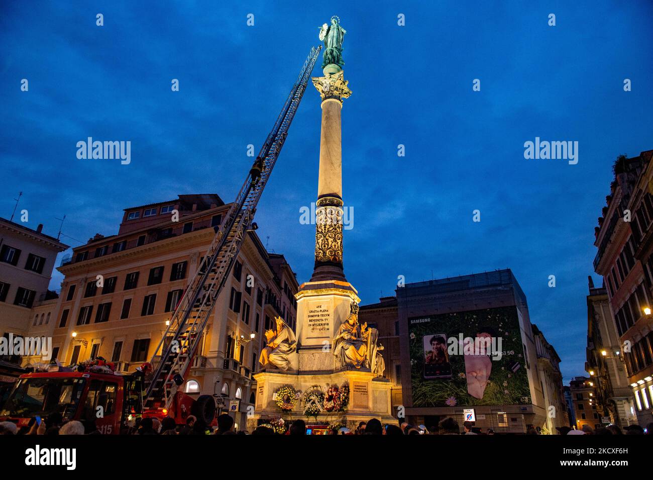 The Fire Brigade pays homage to the statue of the Madonna on the statue ...