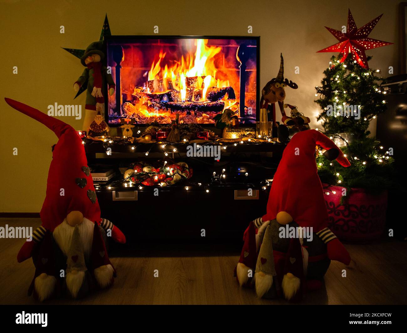 Christmas decorations are already set up in the living room of a home ...