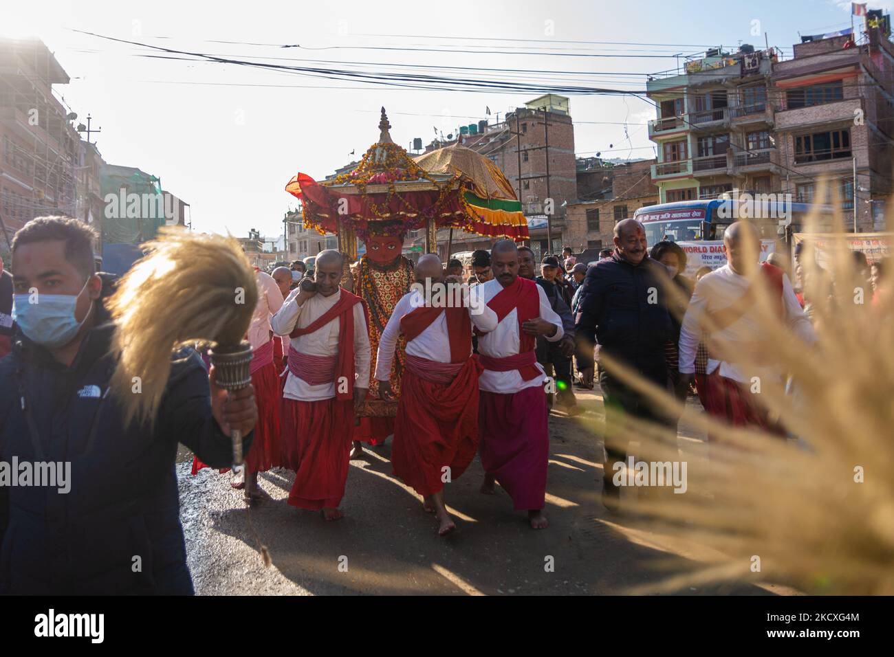 Nepalese Priests carry the idol of Rato Machindranath on a chariot ...
