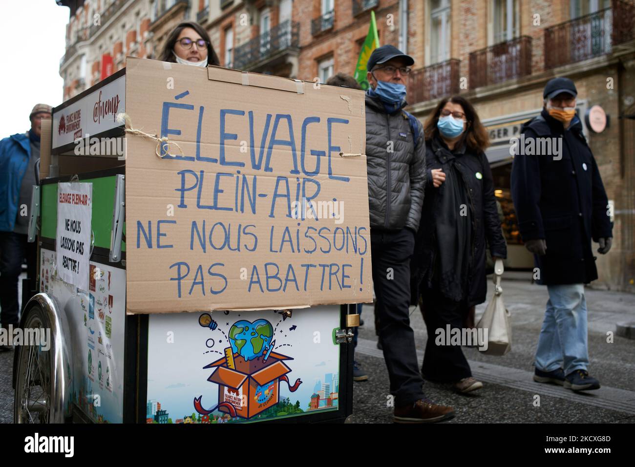 A placard reads 'Extensive open air farming, don't let us be killed ...