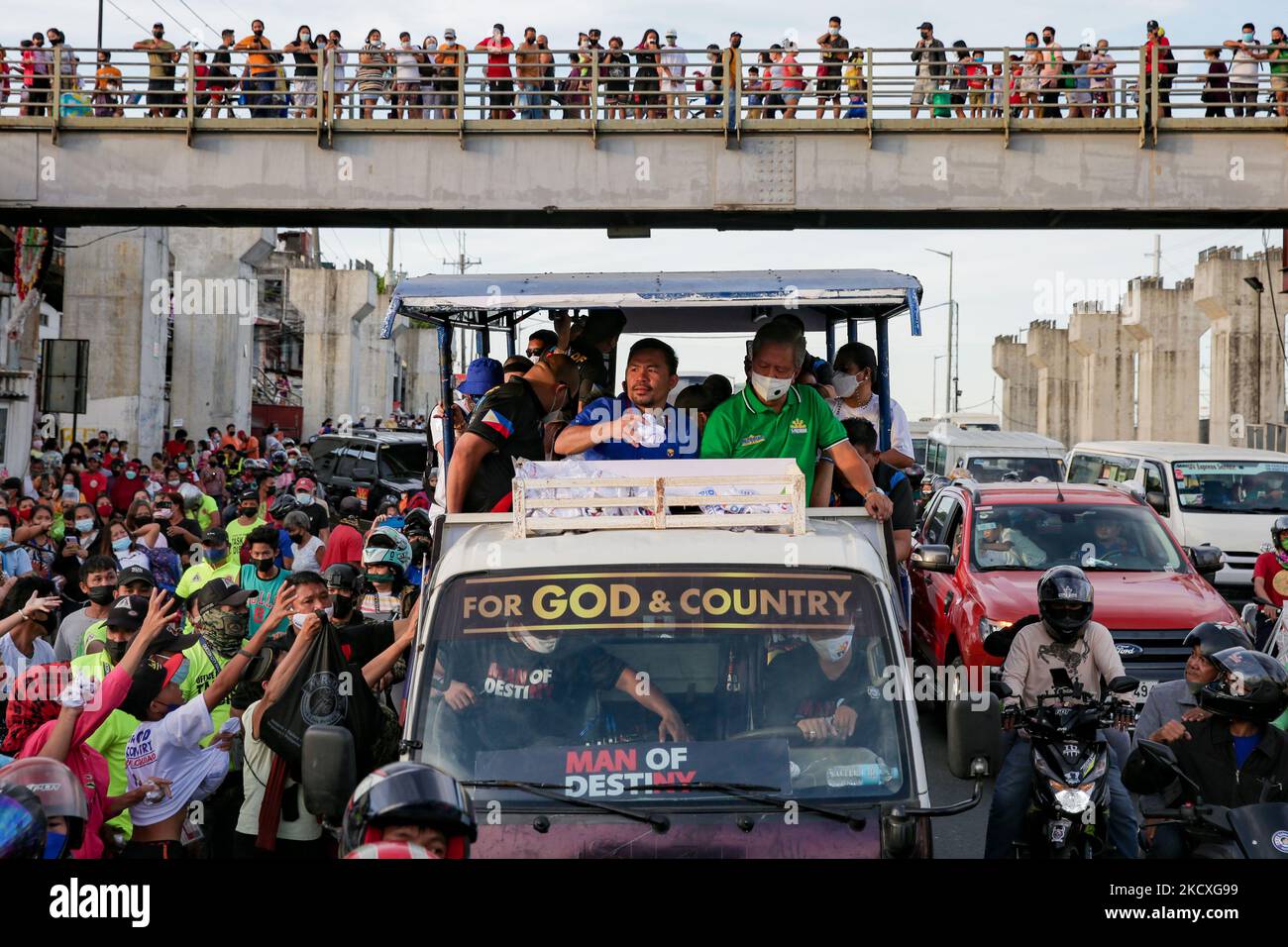 Filipino boxing icon and Senator Manny Pacquiao hands out t-shirts and ...