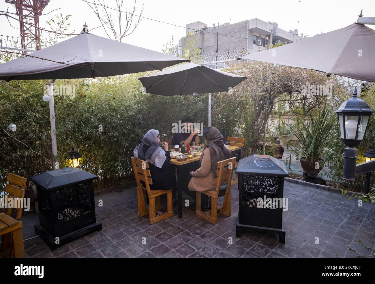 Iranian youths sit together in a cafe in downtown Tehran on December 9 ...