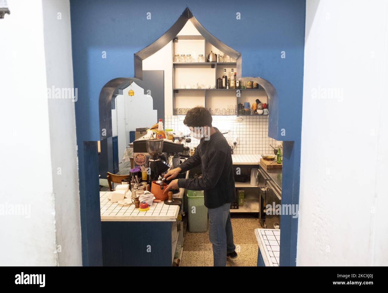 An Iranian barista works in a cafe in downtown Tehran on December 9 ...