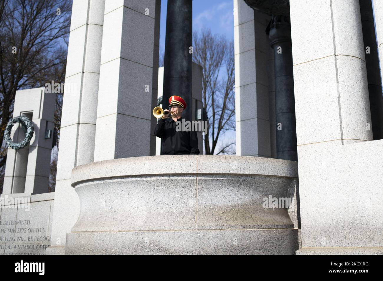 A member of the military band plays “Taps” before the memorial for Sen ...