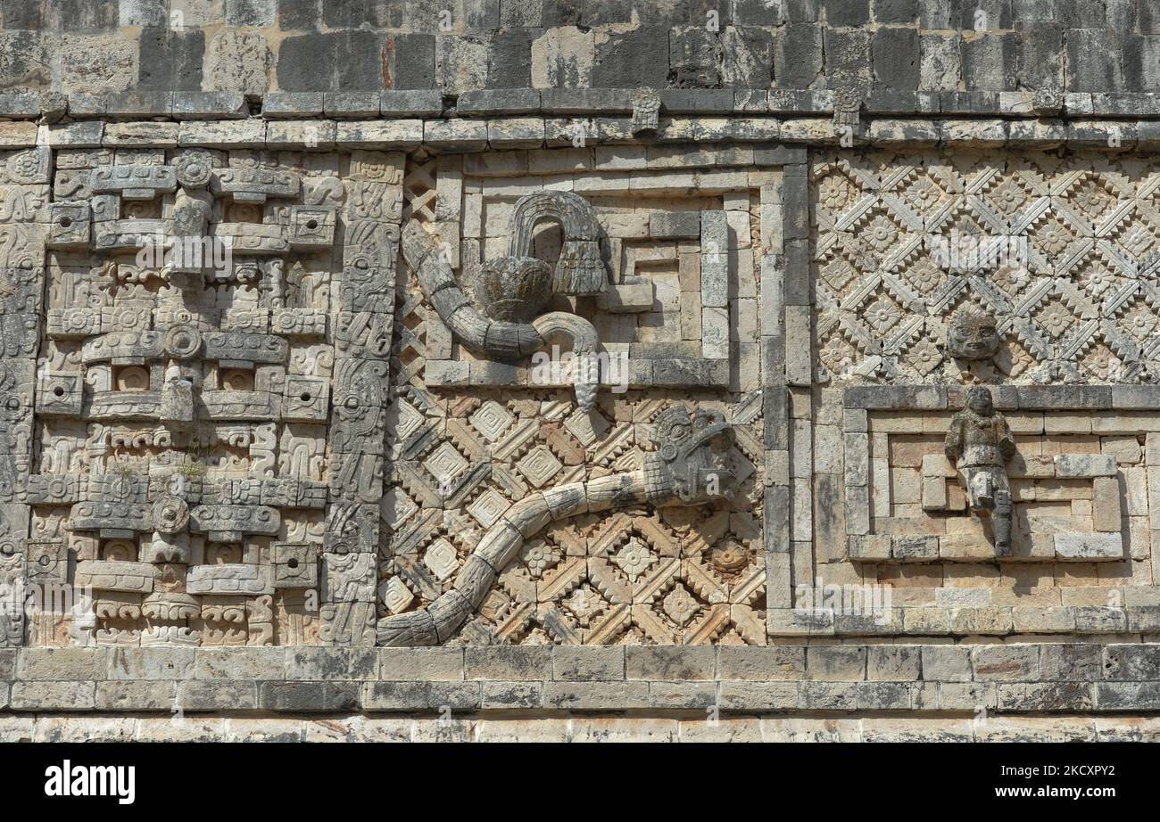 Maya symboles and images of people and animals on the facade of the ...