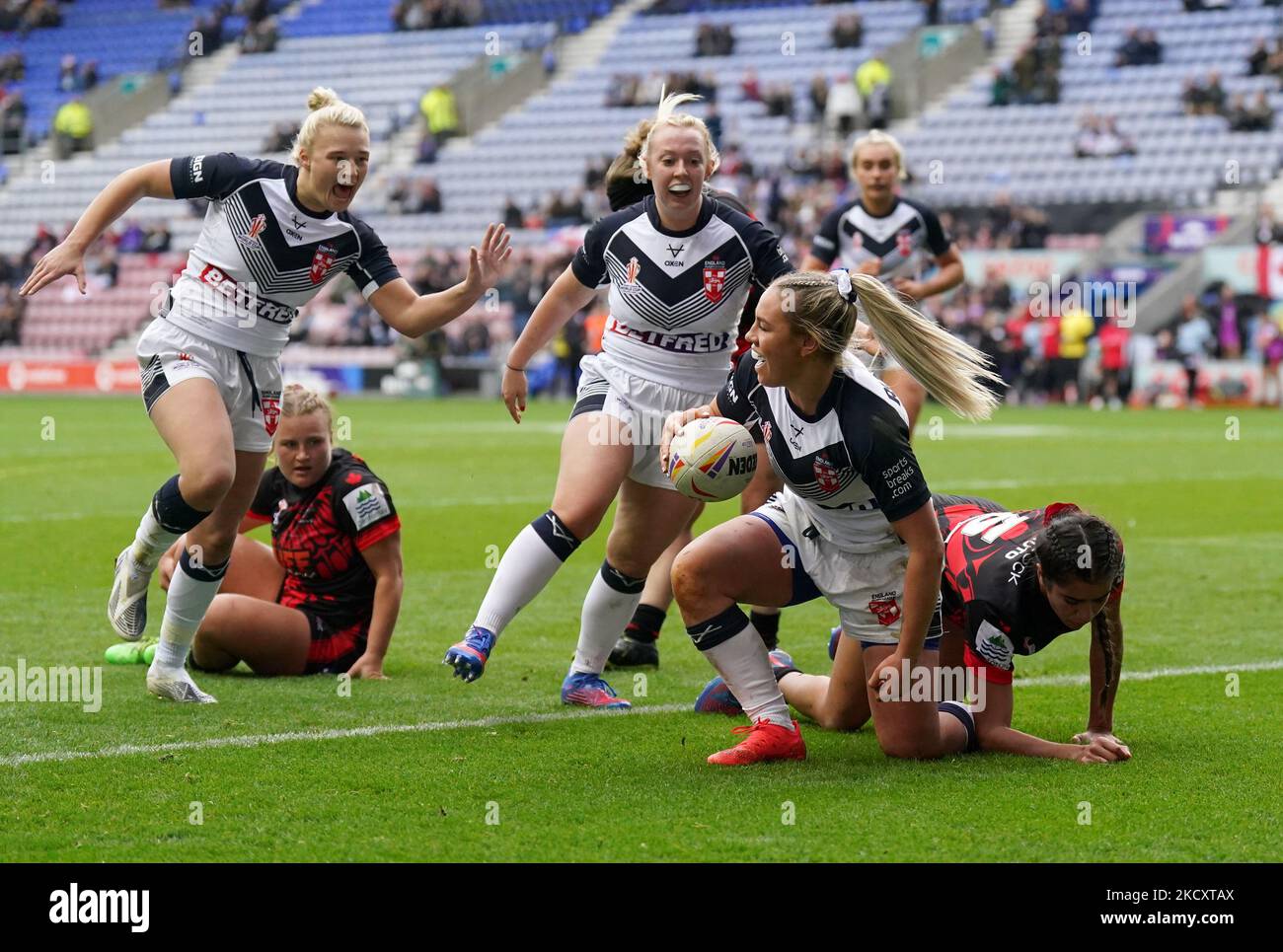 England's Hollie-Mae Dodd celebrates scoring their side's second try ...
