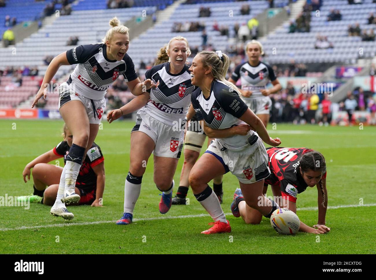 England's Hollie-Mae Dodd celebrates scoring their side's second try ...