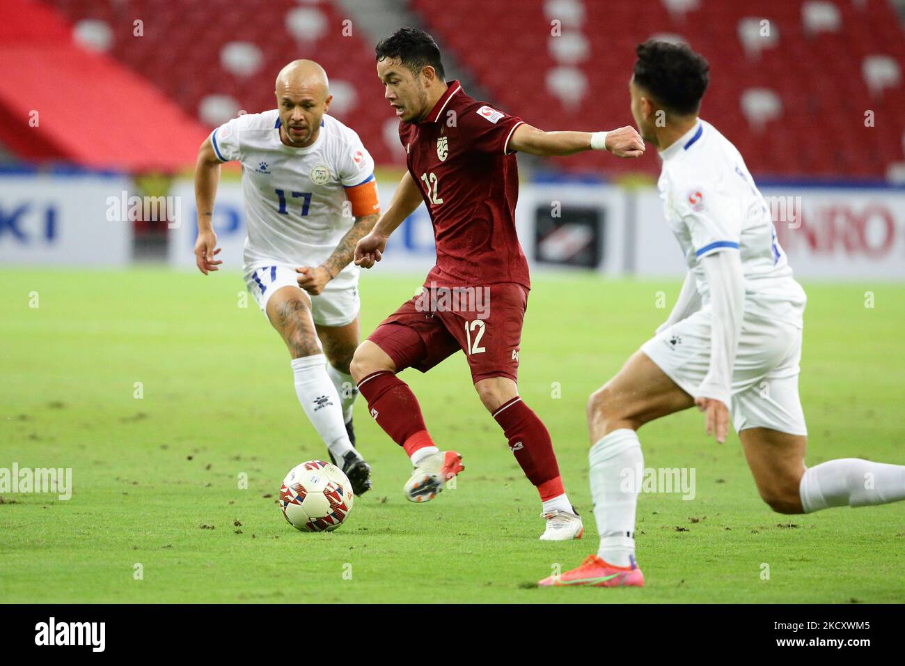 Thanawat Suengchitthawon of Thailand (C) controls the ball during the ...