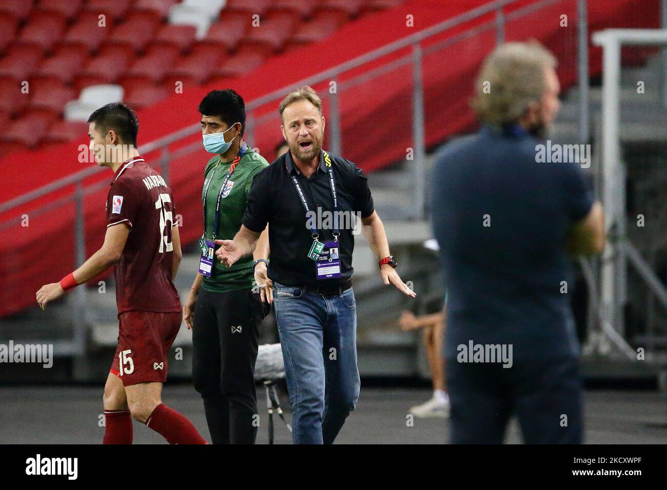 Thailand head coach, Alexandre Polking (2nd R) reacts after Thailand is ...
