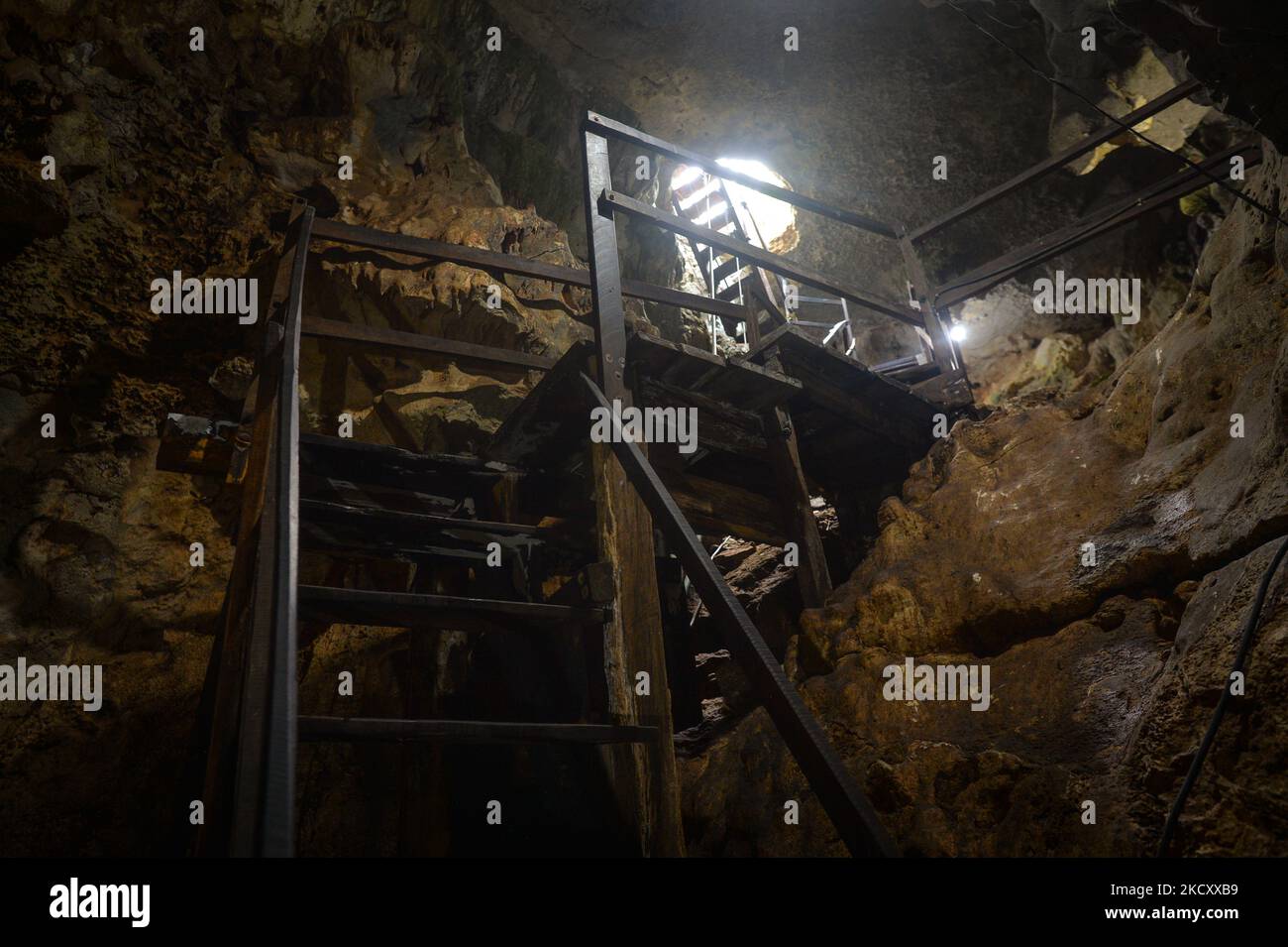 Wooden stairs inside the Cenote Chulul, in Homún. Chulul is one of the ...