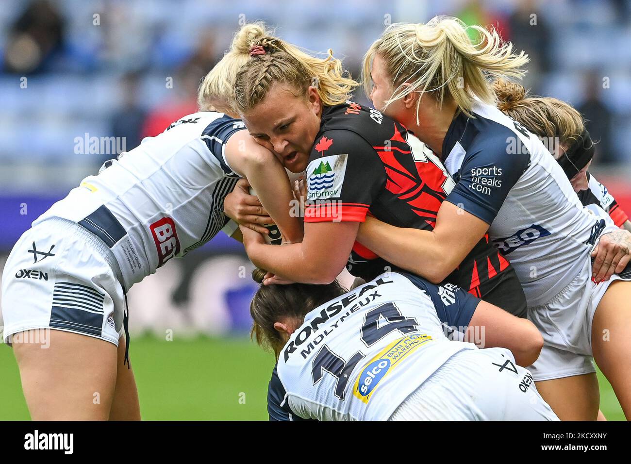 Rachel Chaboter of Canada is tackled by Tara Stanley, Vicky Molyneux ...