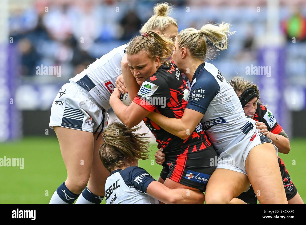 Rachel Chaboter of Canada is tackled by Tara Stanley, Vicky Molyneux ...