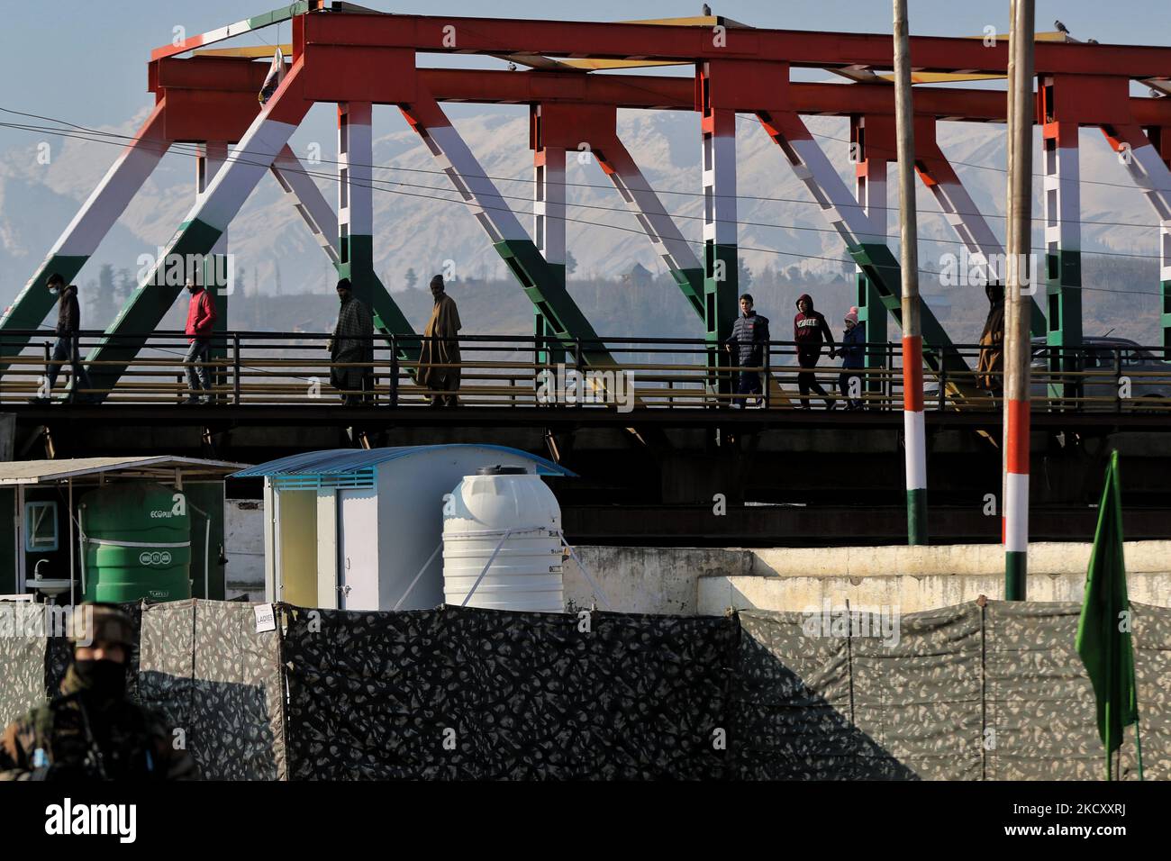 Kashmiri people cross a bridge painted with Tri-Color (National Flag ...