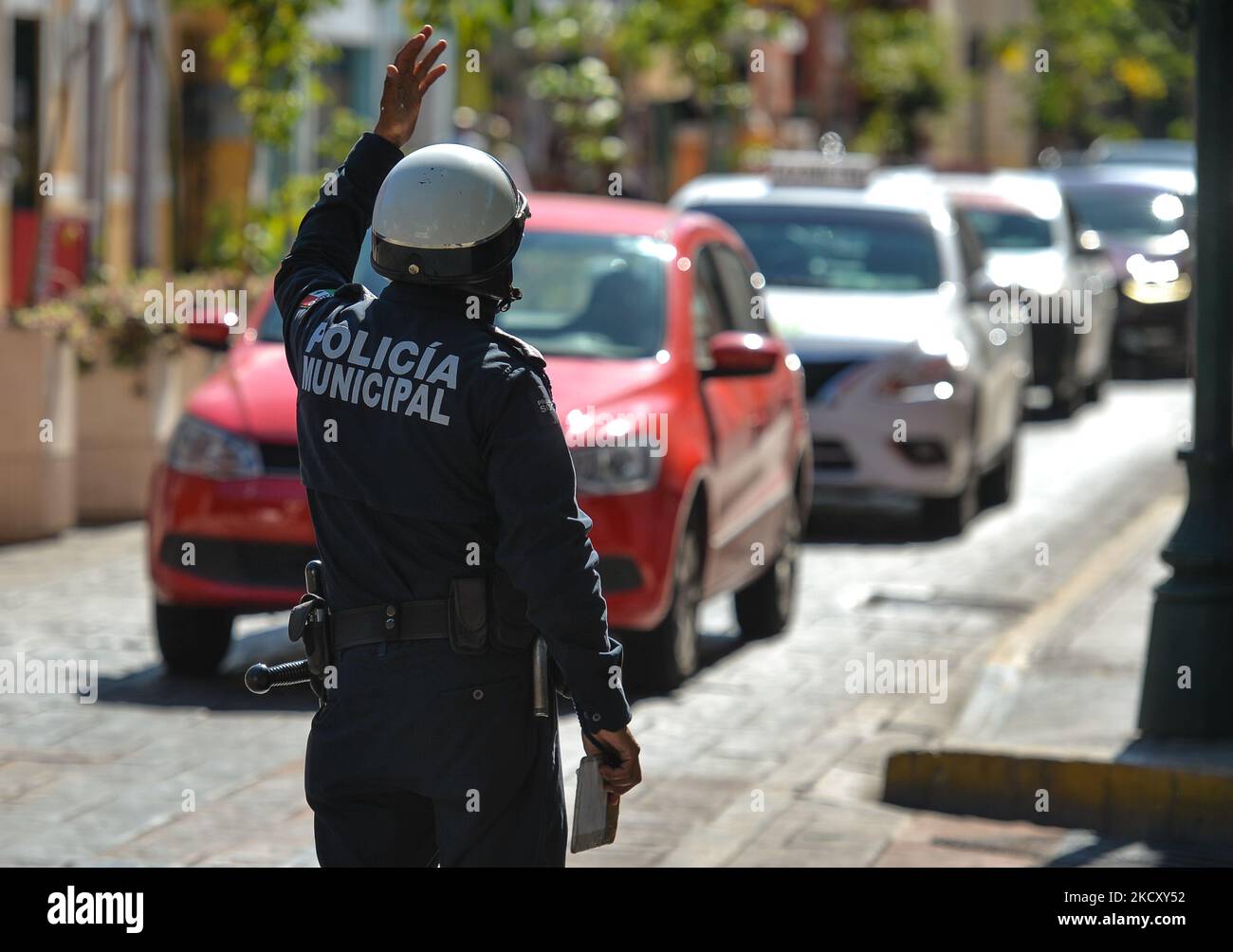 A member of the Policia Municipal (Municipal Police) manages the ...