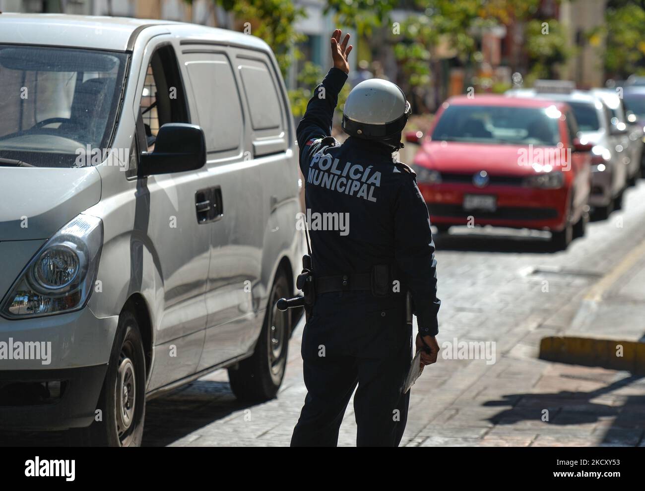 A member of the Policia Municipal (Municipal Police) manages the ...