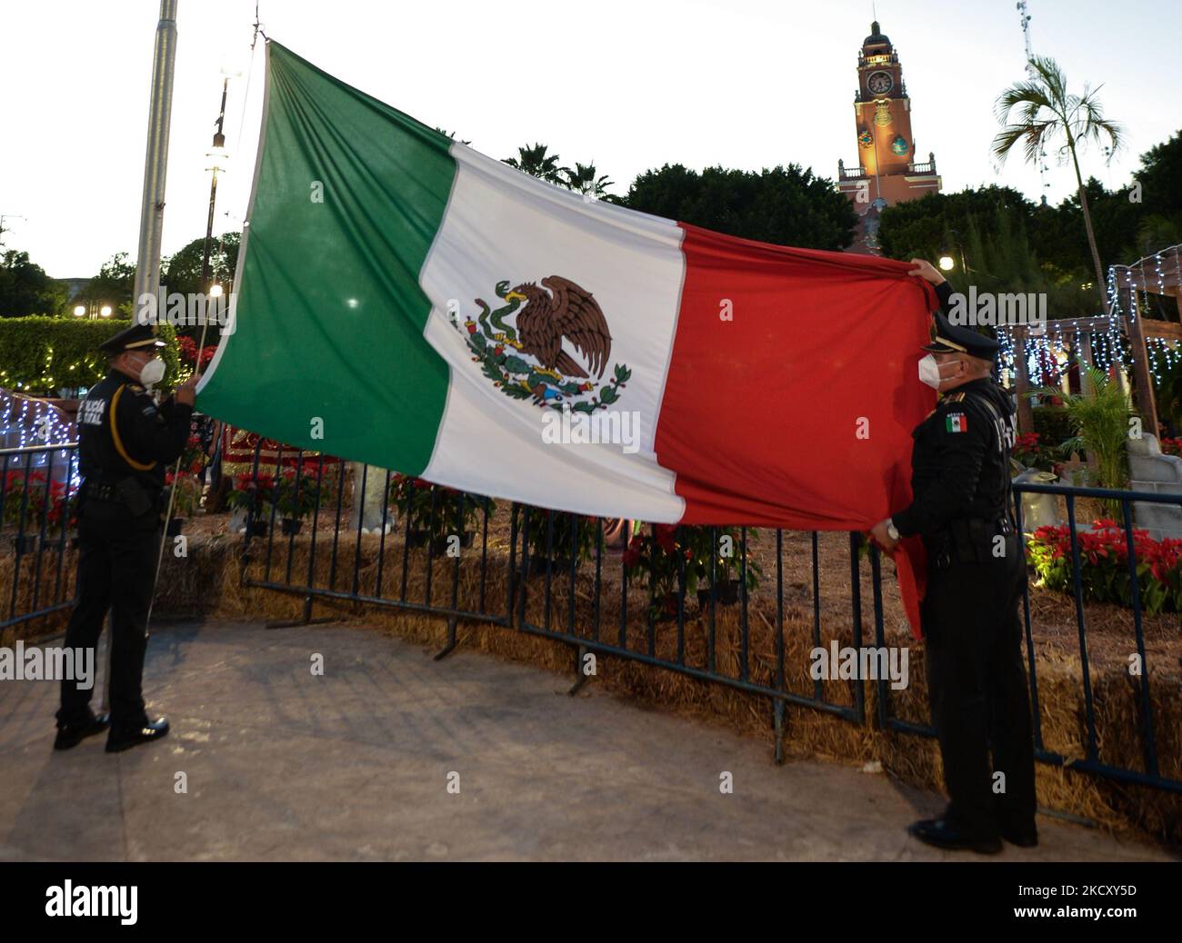 Members of the Policia Municipal (State Police) wearing face masks fold ...
