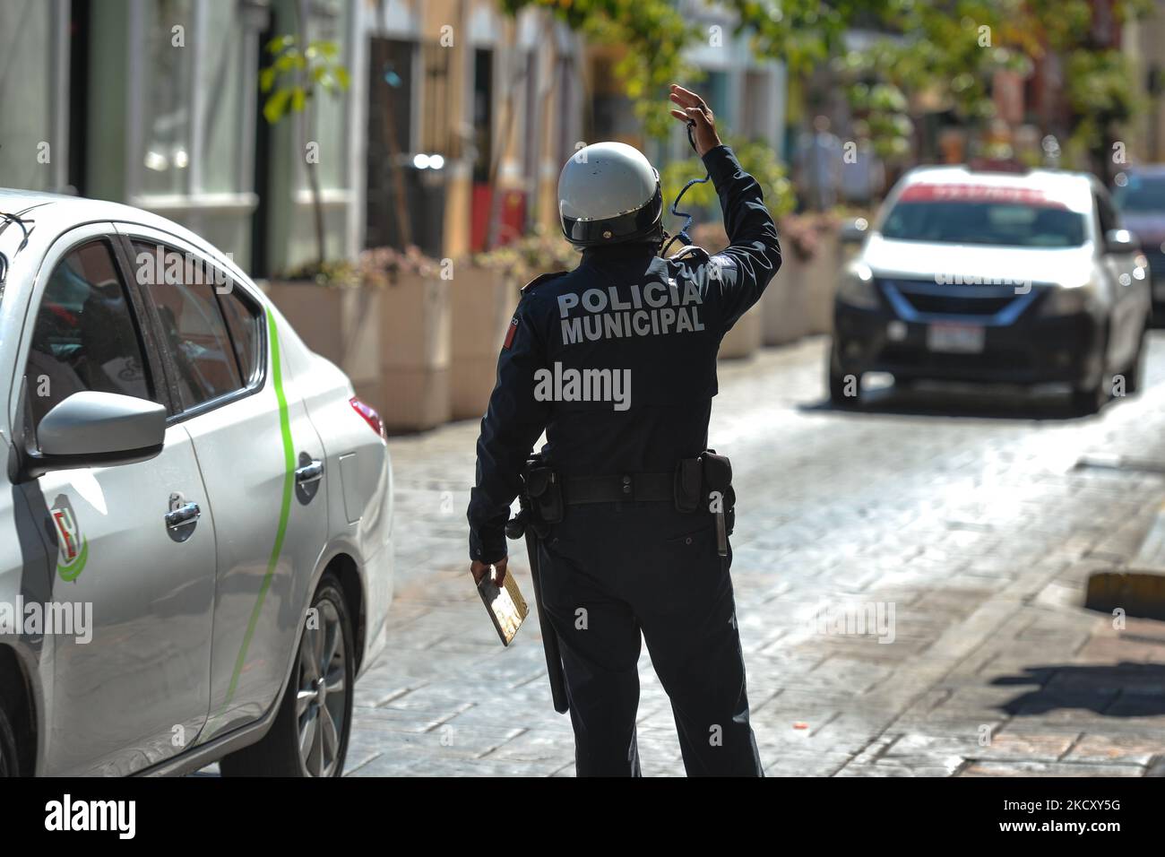 A member of the Policia Municipal (Municipal Police) manages the ...