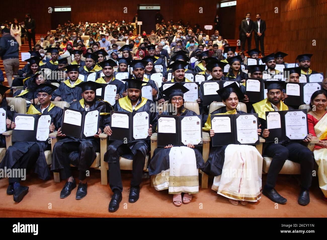 Students pose with their degree during the Dr. Bhimrao Ambedkar Law ...