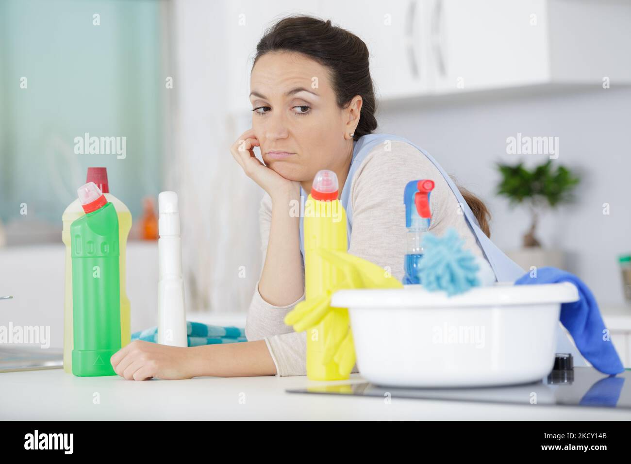 portrait of a tired cleaning lady Stock Photo - Alamy