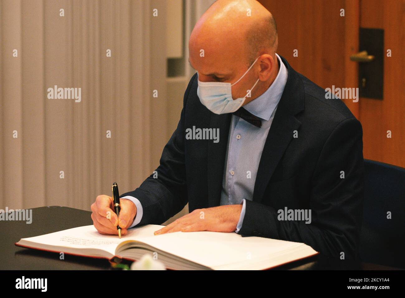 Nobel Prize winner Professor Dr. Benjamin List signs a guest book with ...