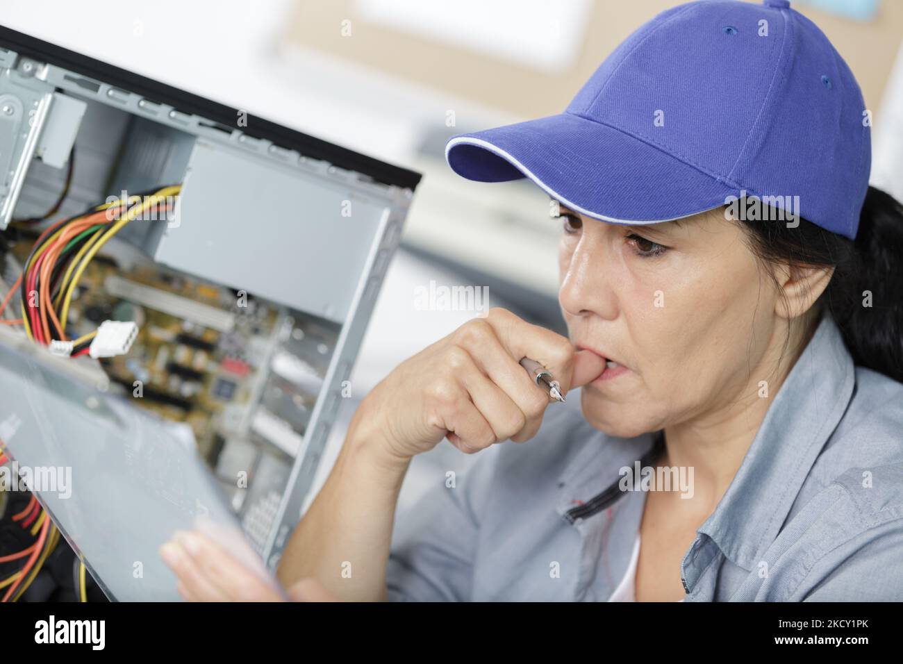 a middle-aged checking a computer Stock Photo - Alamy