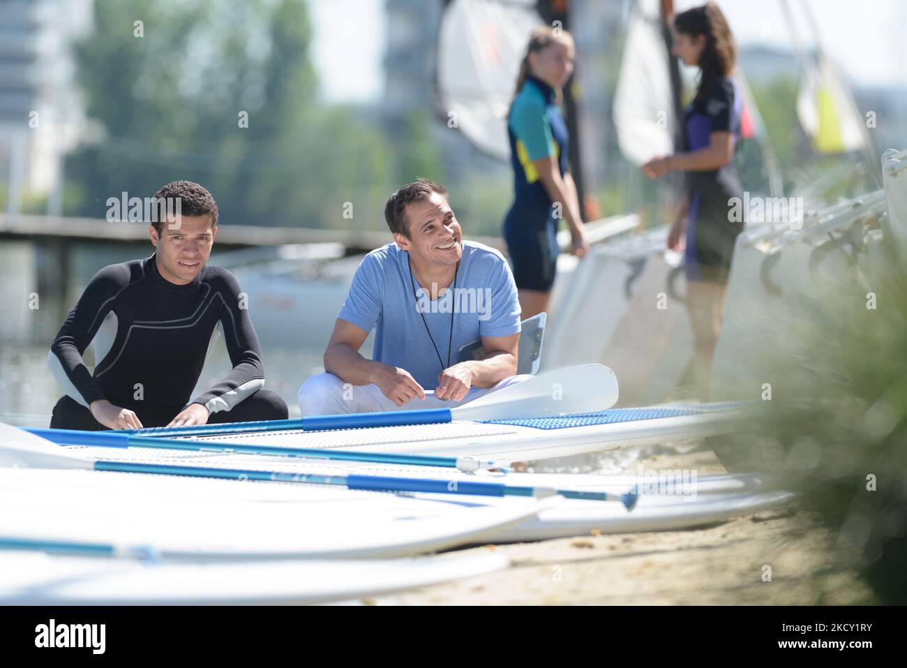 Surfer paddling out into the waves hi-res stock photography and images ...