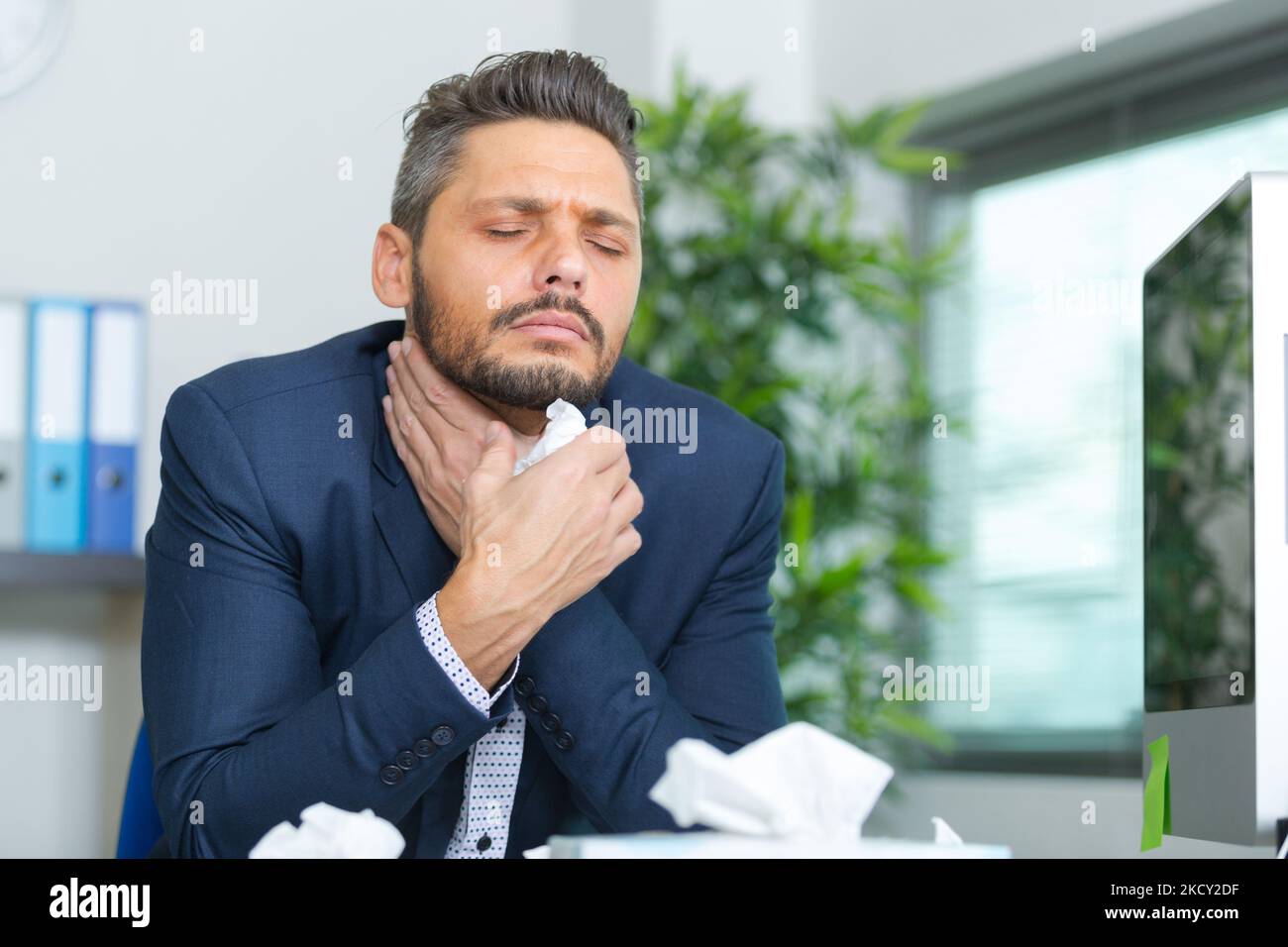 sick professional in the office Stock Photo - Alamy