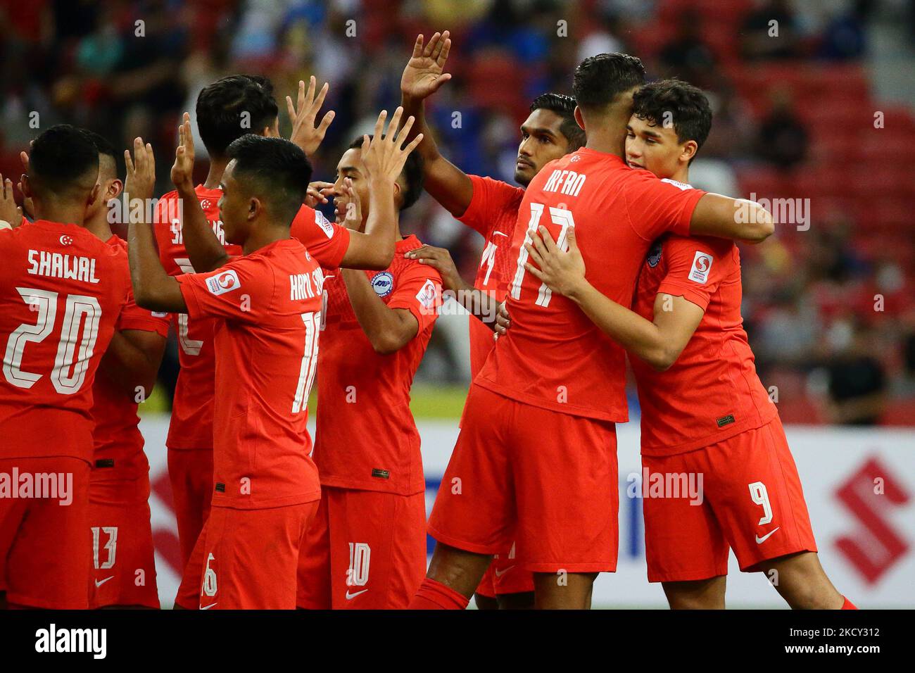 Brothers, Ikhsan Fandi (R) of Singapore and Irfan Fandi shares a hug ...