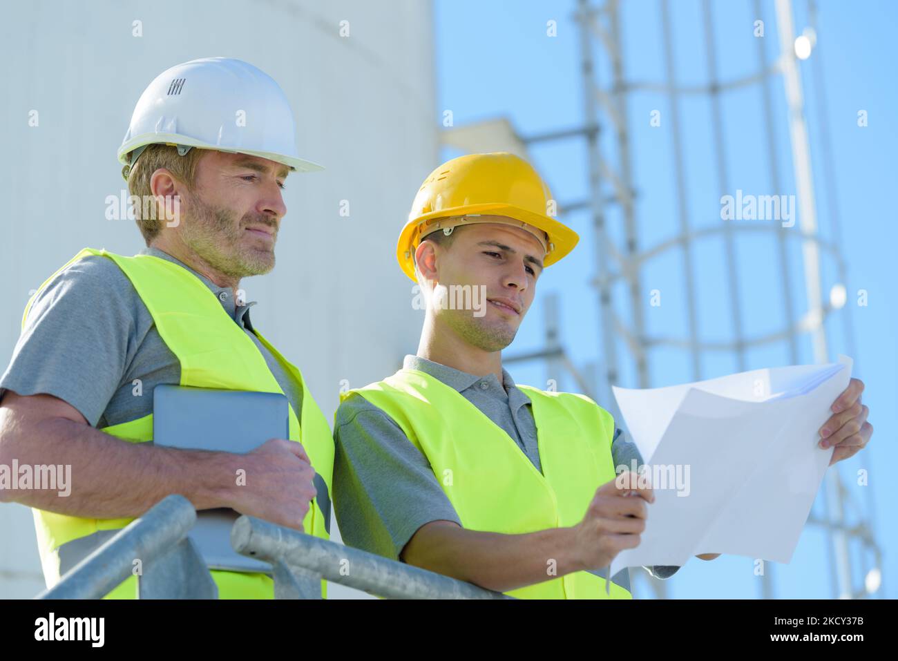 worker and boss outside factory Stock Photo - Alamy