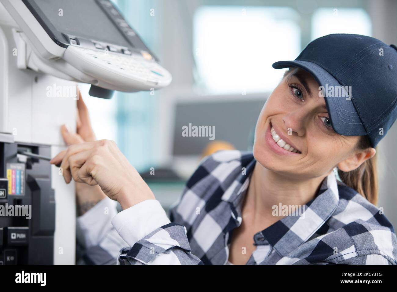female technician fixing a printer Stock Photo - Alamy