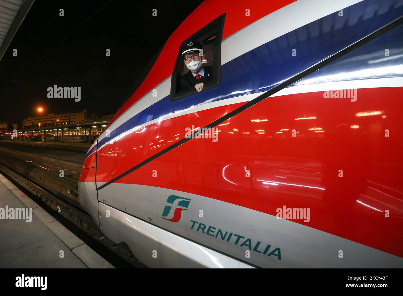 A high-speed train driver stands in the first Frecciarossa, a high ...