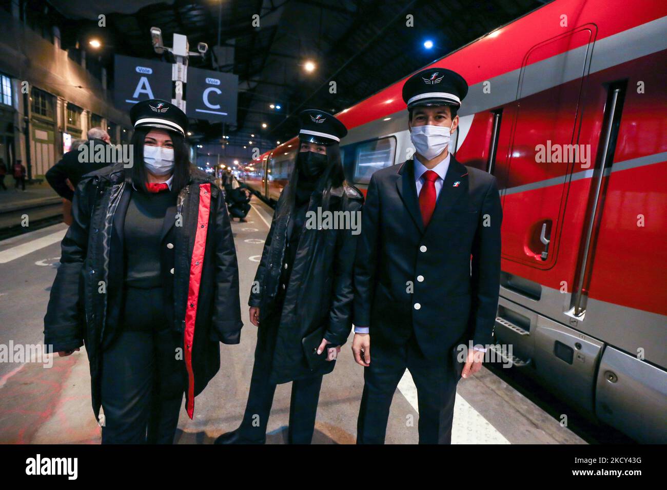Employees welcome travellers past the first Frecciarossa, a high-speed ...