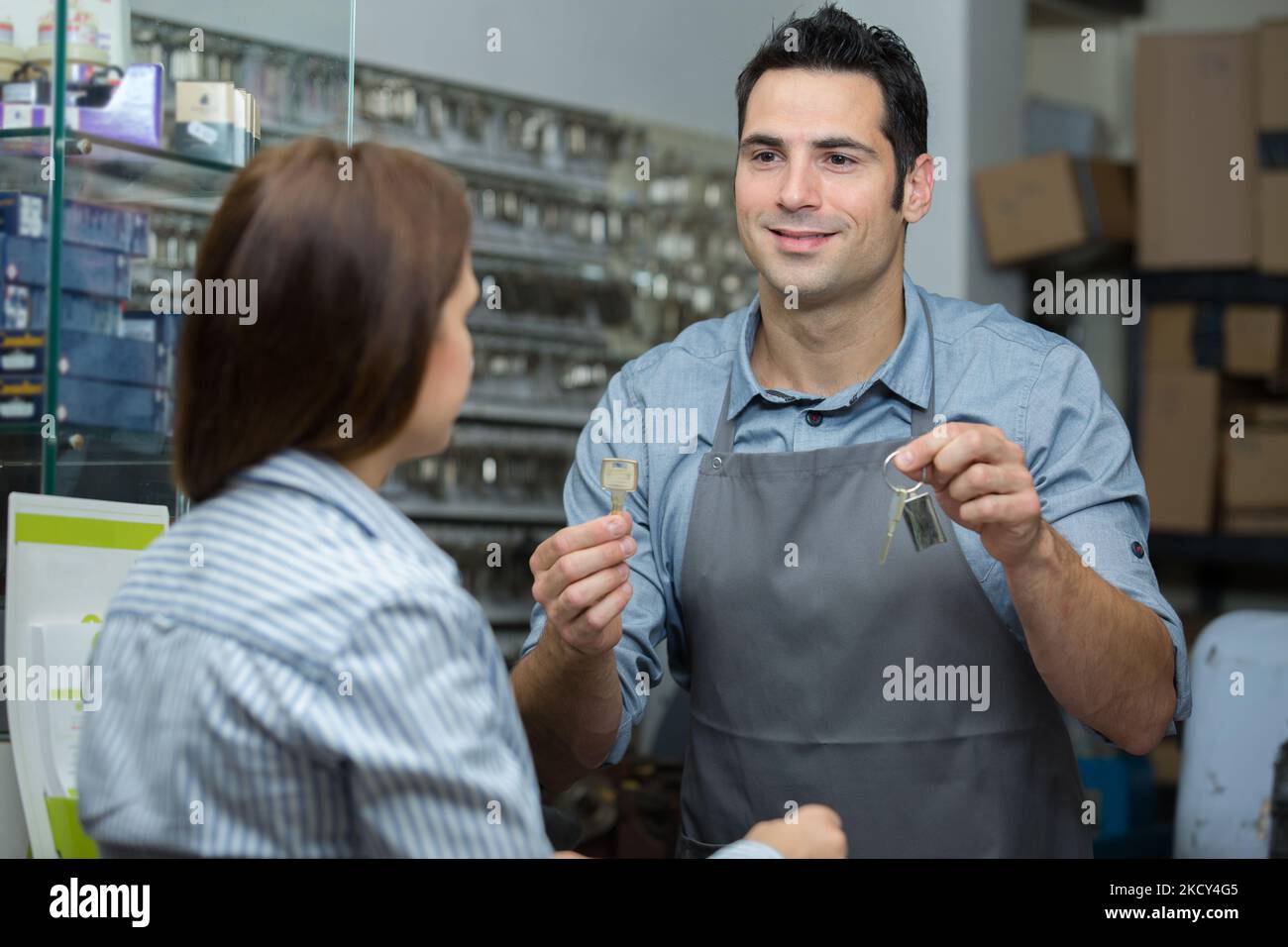 man selling a set of keys Stock Photo - Alamy