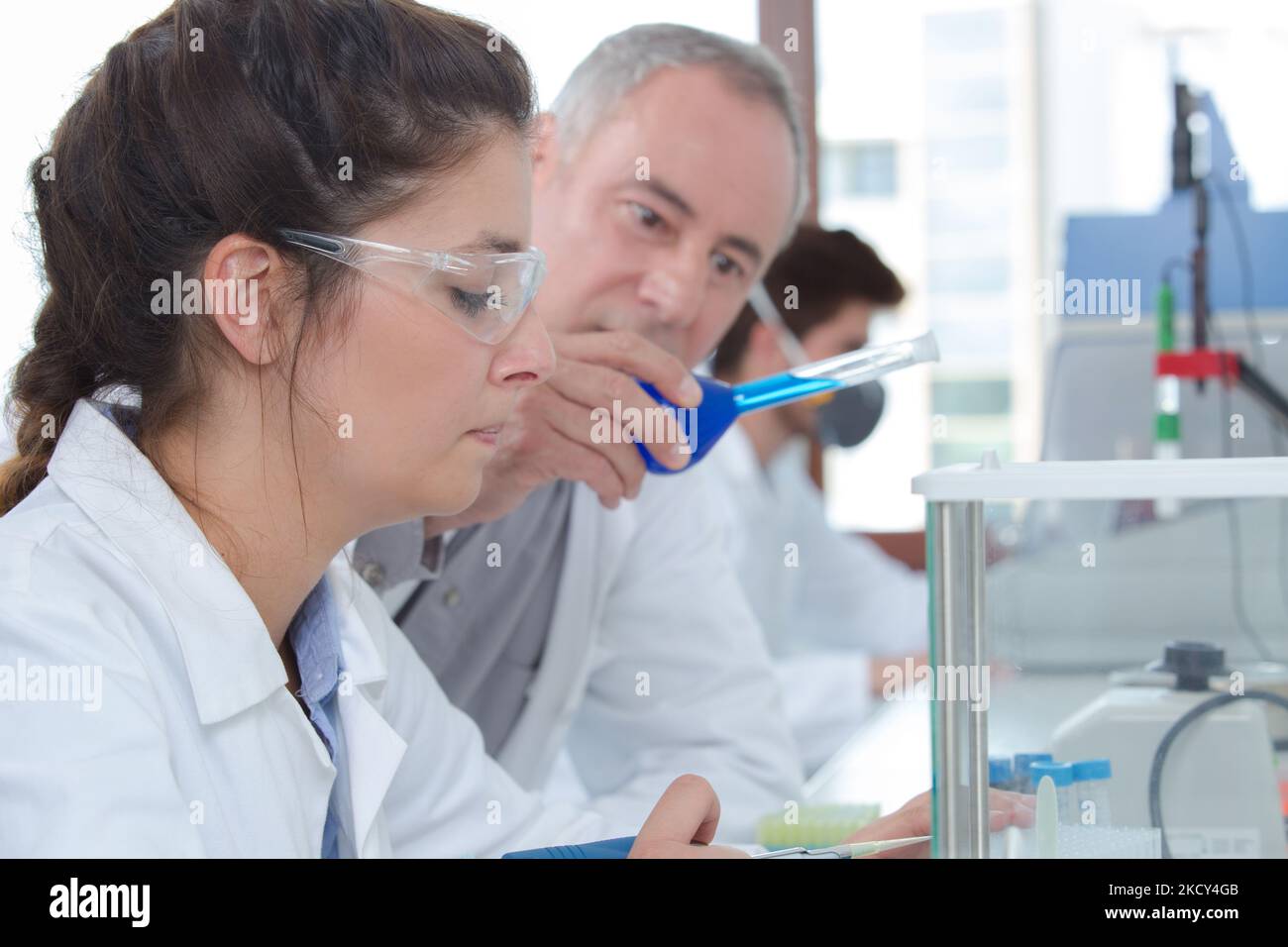 Scientists performing experiment hi-res stock photography and images ...