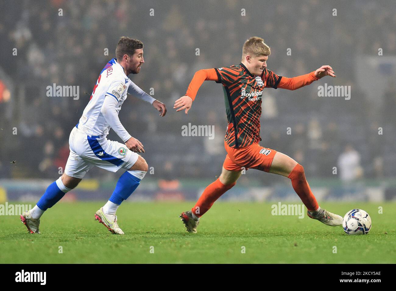 Jordan James of Birmingham City tussles with Joe Rothwell of Blackburn ...