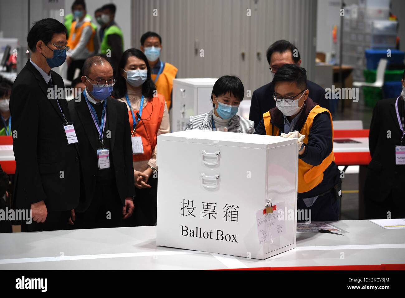 Officials are seen inspecting a ballot box at the counting table in the ...