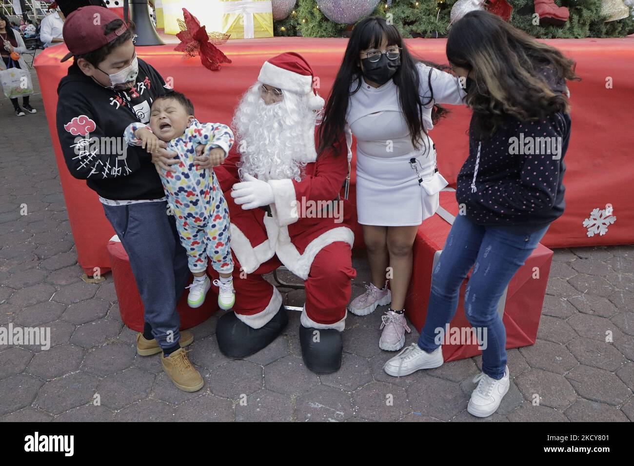 A person dressed as Father Christmas in a Christmas village on the ...