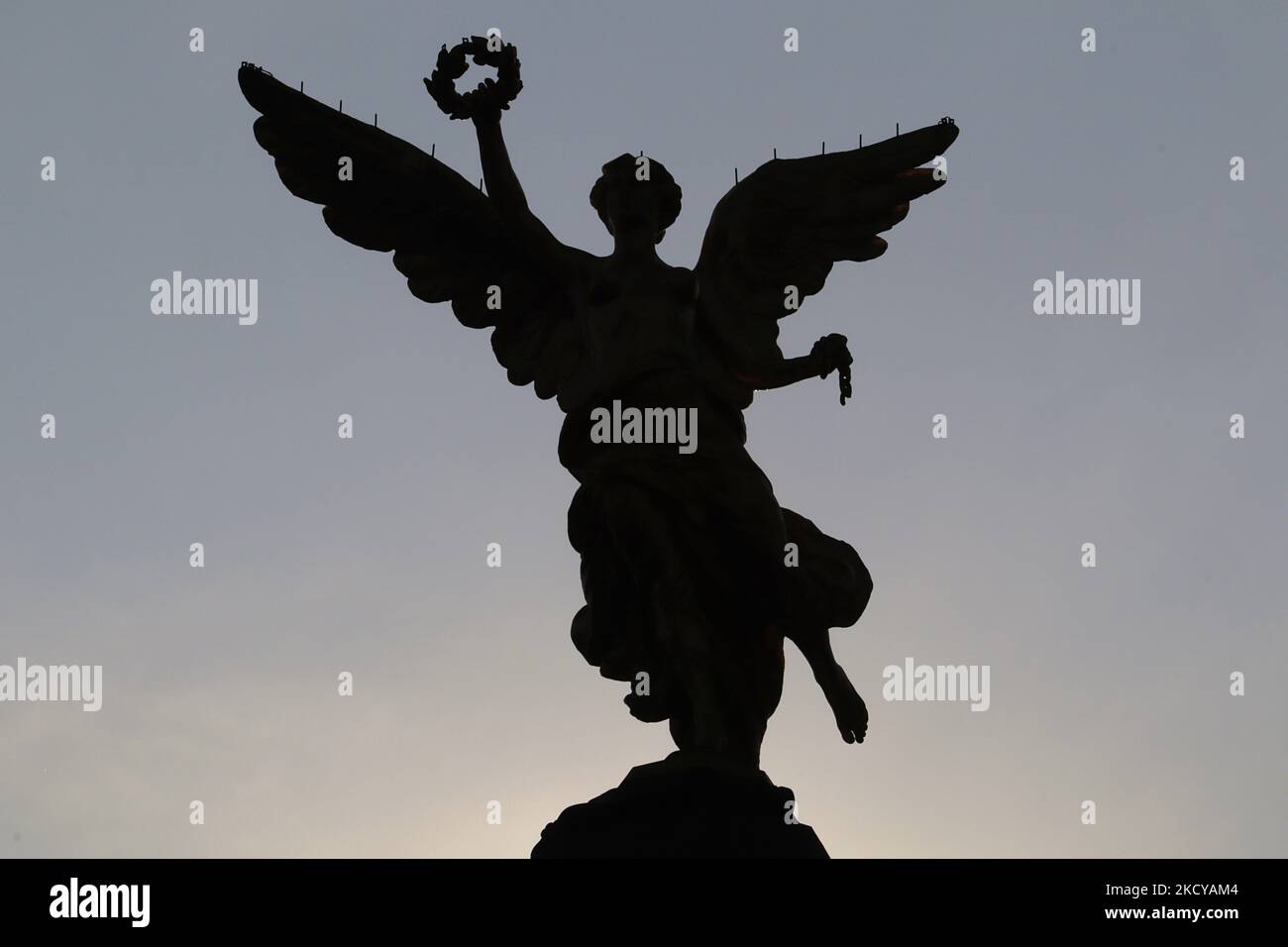 A backlight view of the Angel of Independence in Mexico City, during ...