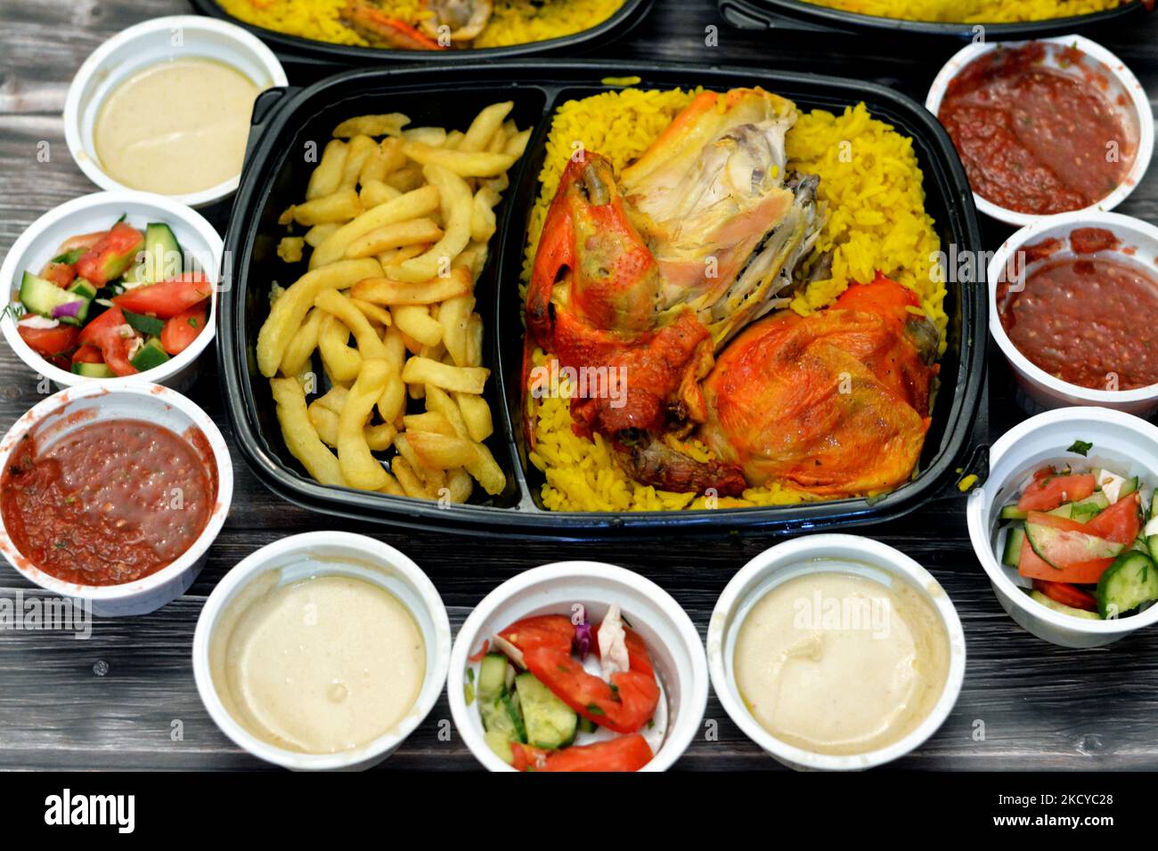 Chicken mandi kabsa with long basmati rice and french fries, served ...