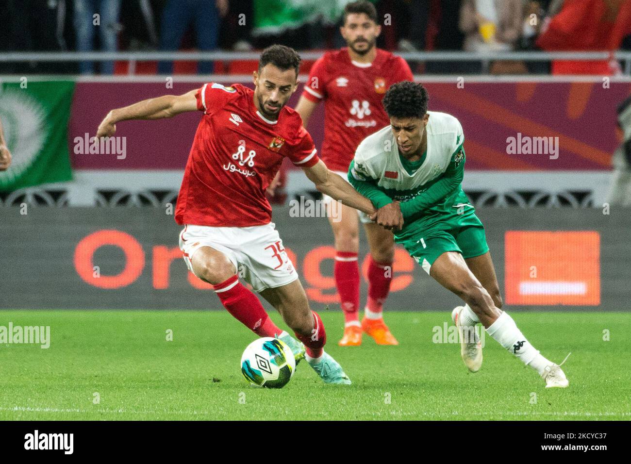 (35) Ahmed Radwan of Al Ahly team battles for possession with (7) H ...