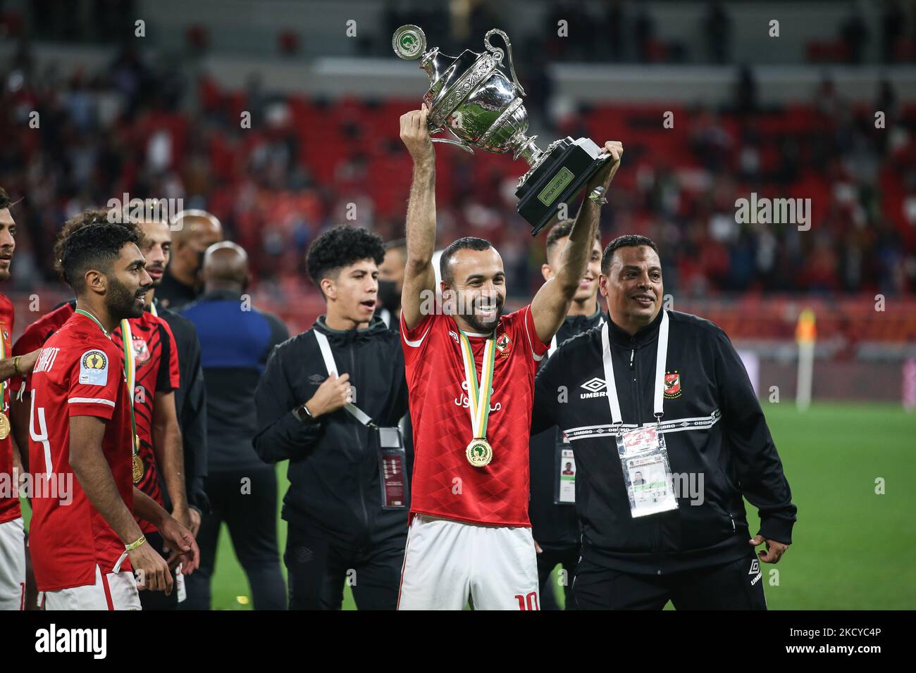 (19) Mohamed Magdi Kafsha of Al Ahly team lifts the Super Cup trophy ...