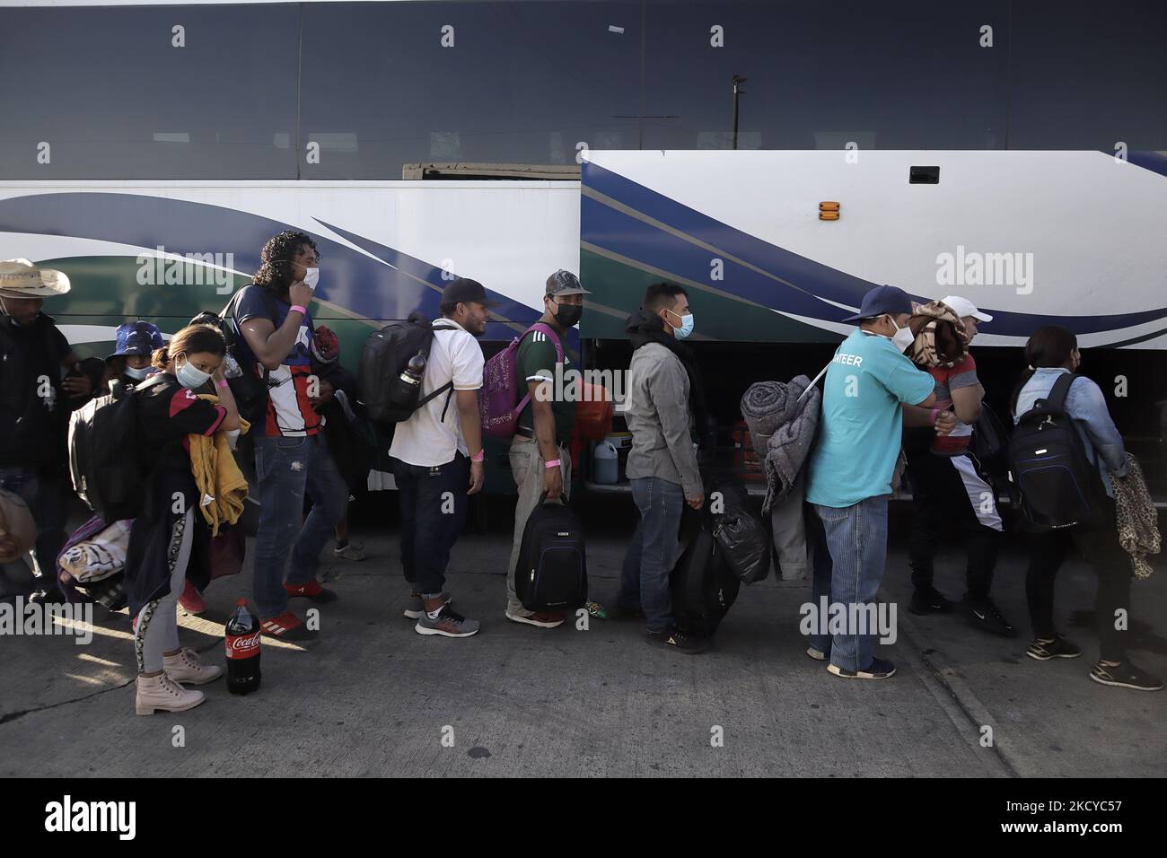 Members of the migrant caravan in the car park of the Casa Peregrino ...