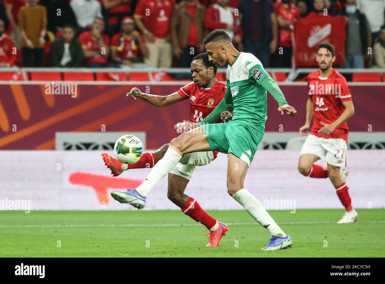 (23) Percy Tau of Al Ahly team battles for possession with (35) J ...