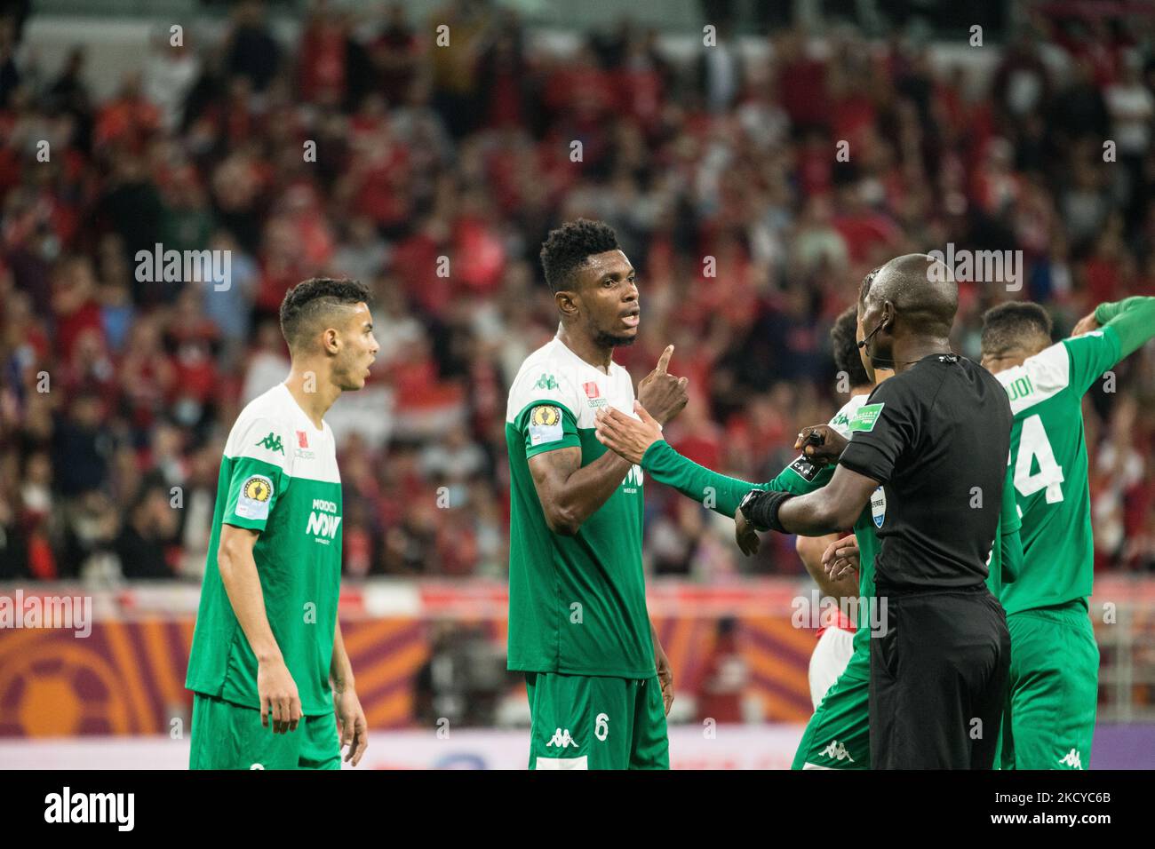 (6) F. Ngoma of Al Raja team taking with Referee JEAN-JACQUES NGAMBO ...