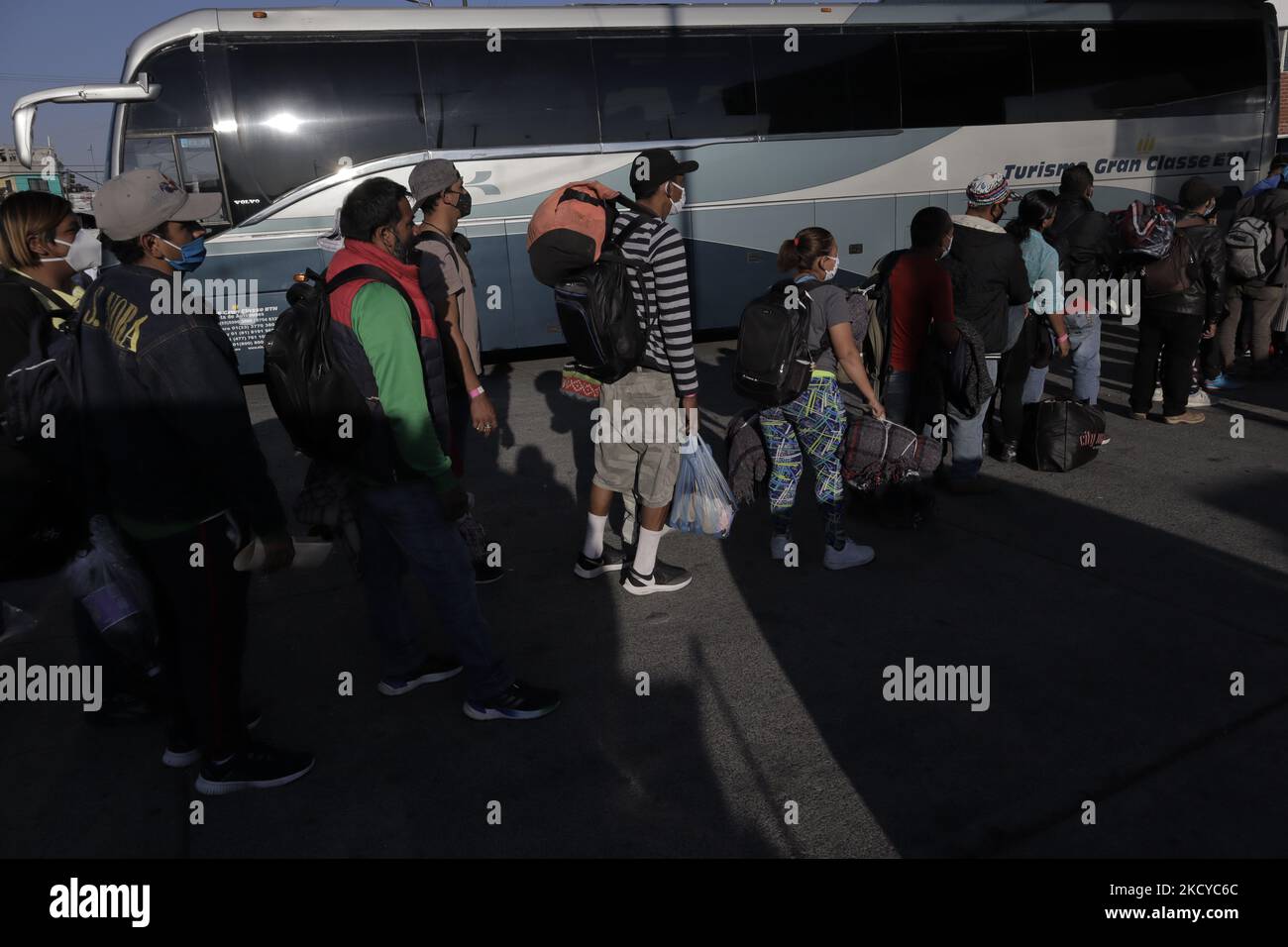 Members of the migrant caravan in the car park of the Casa Peregrino ...