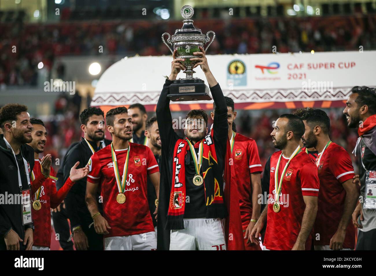 (25) Akram Tawfik of Al Ahly team lifts the Super Cup trophy following ...