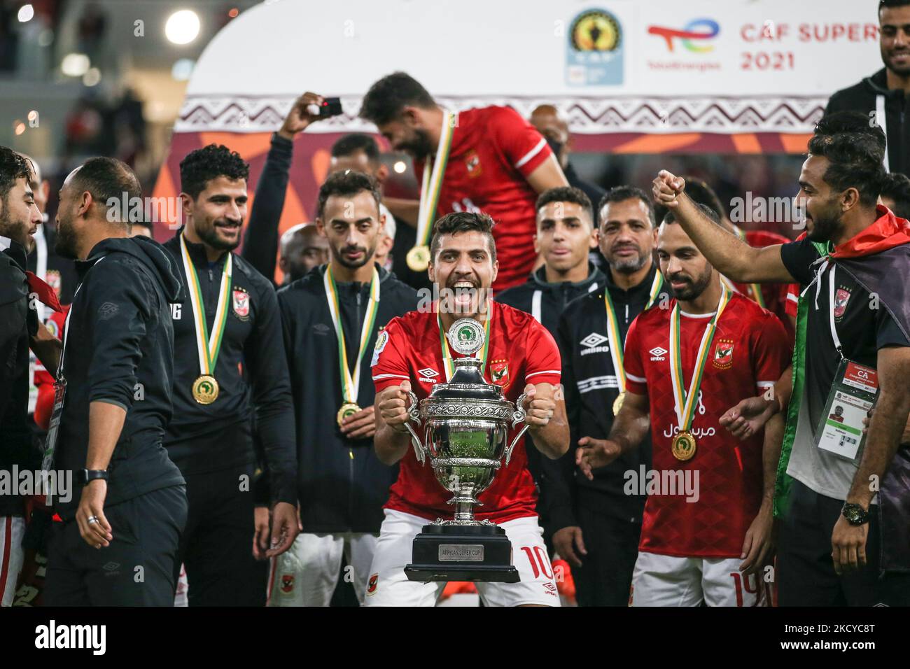 (10) Mohamed Sherif of Al Ahly team lifts the Super Cup trophy ...
