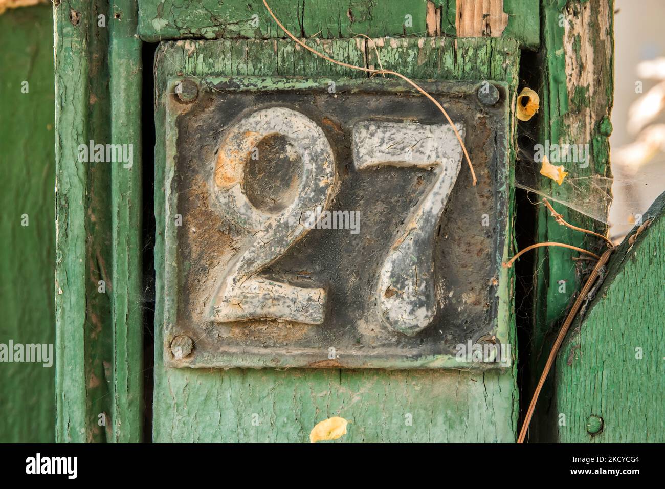 Old retro weathered cast iron plate with number 27 closeup Stock Photo ...